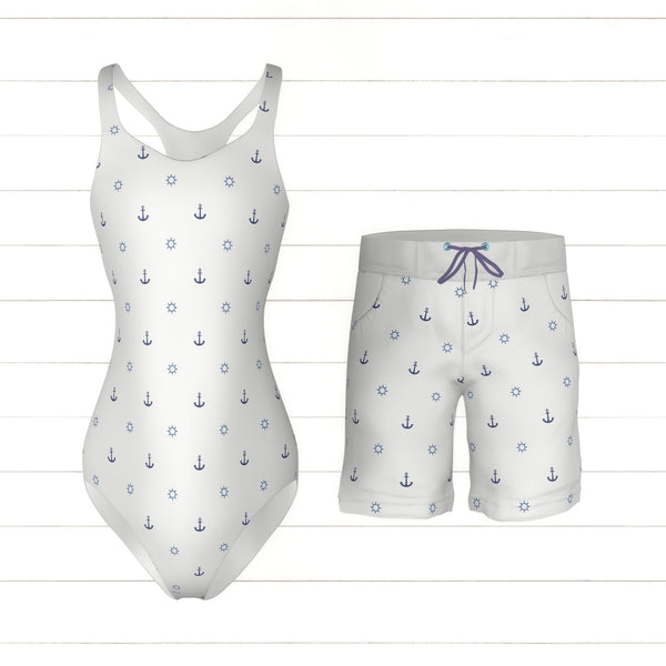 little cobalt blue ship's wheel and deep blue anchor on a solid white ...