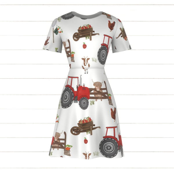 Colourful farm design featuring a red tractor and farmyard animals on ...